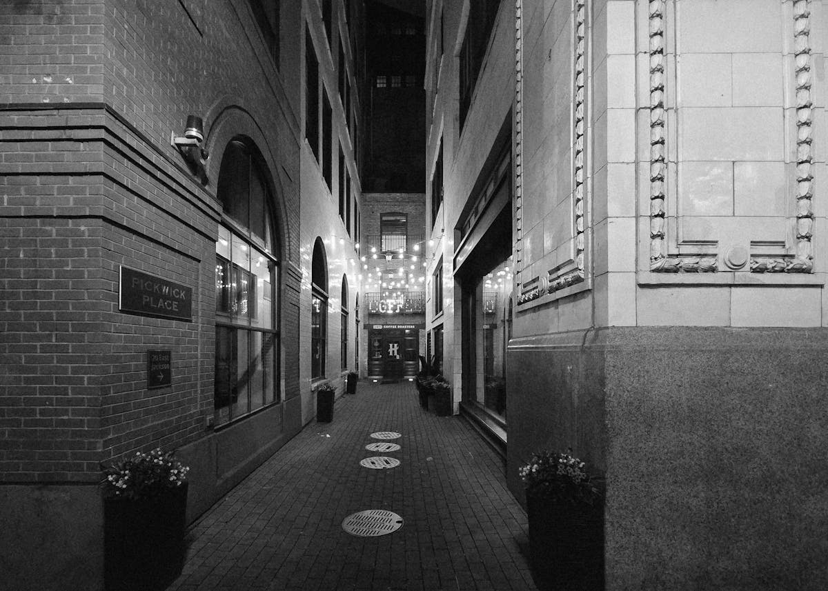 Black and white alleyway with string lights in Chicago at night