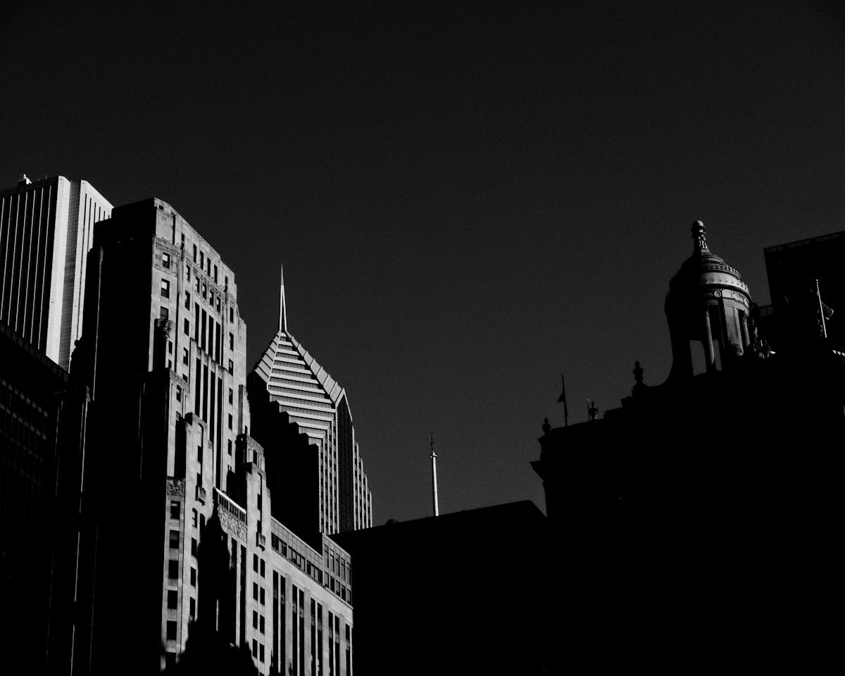 Dramatic silhouette of Chicago skyscrapers against a dark sky