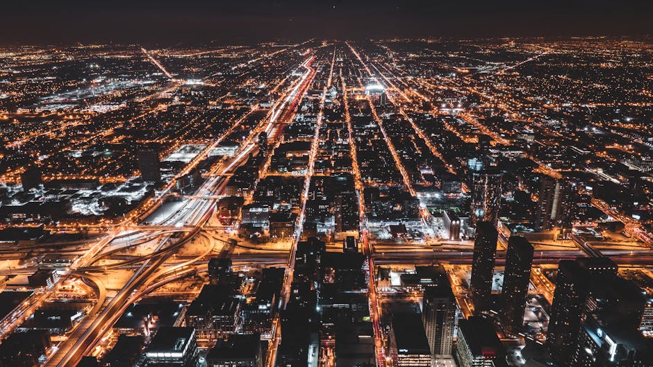 Chicago illuminated city grid at night from above
