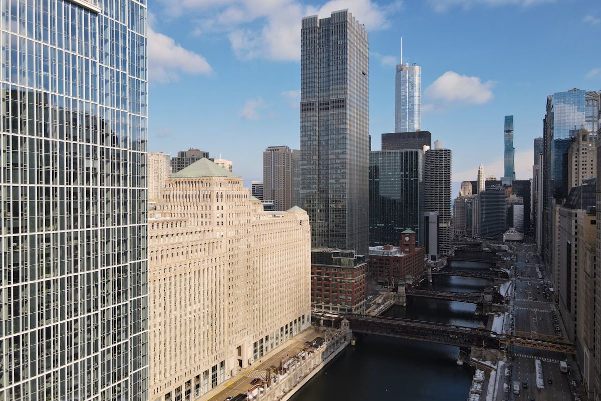Aerial view of Chicago skyline featuring the Chicago River and modern skyscrapers