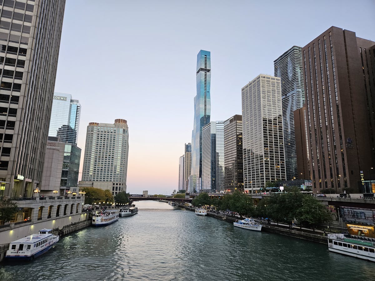 Chicago skyline along the river at golden hour