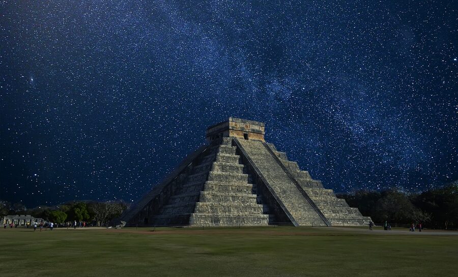 Chichen Itza El Castillo pyramid under Milky Way stars at night