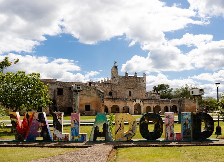 Colorful Valladolid town sign in front of historic church