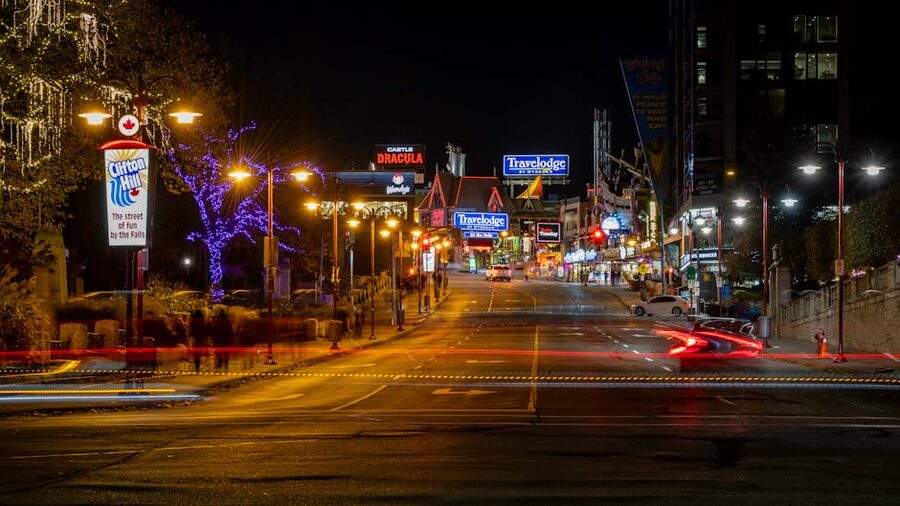 Clifton Hill street in Niagara Falls at night with neon signs