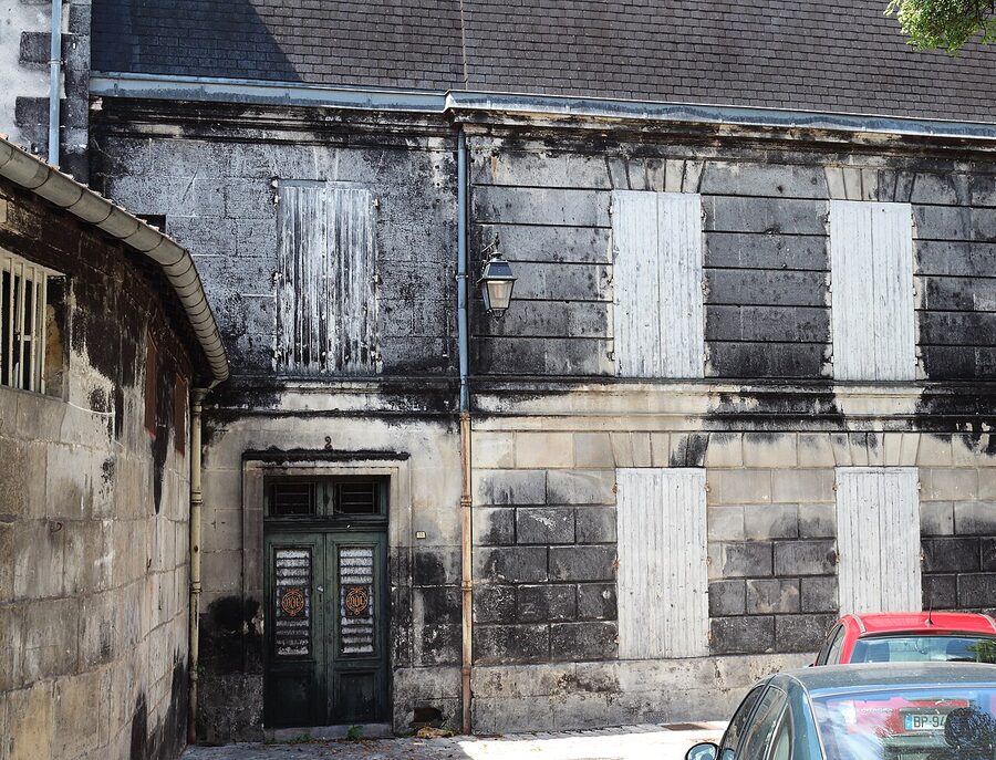Black mould on Cognac warehouse wall caused by angels share evaporation