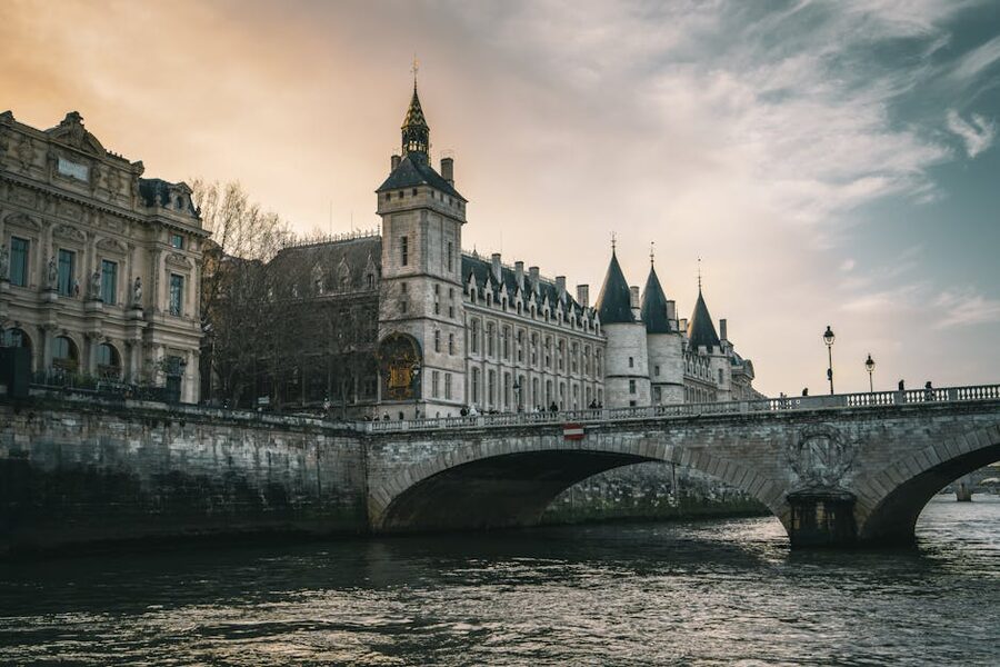 Conciergerie and Pont au Change at sunset over the Seine