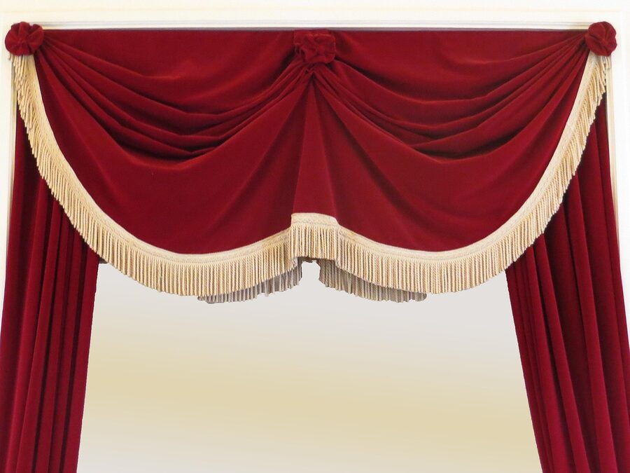 Cabaret stage with red curtain awaiting Crazy Horse Paris show
