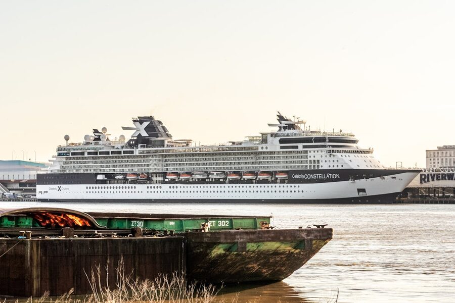 Large cruise ship docked along the Mississippi River in New Orleans