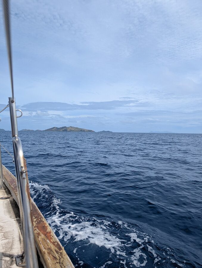 Distant view of Mana Island from a sailing boat in Fiji