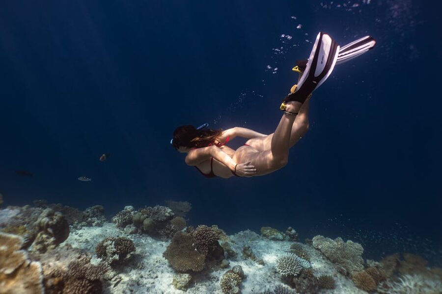 A snorkeller exploring a Fijian coral reef