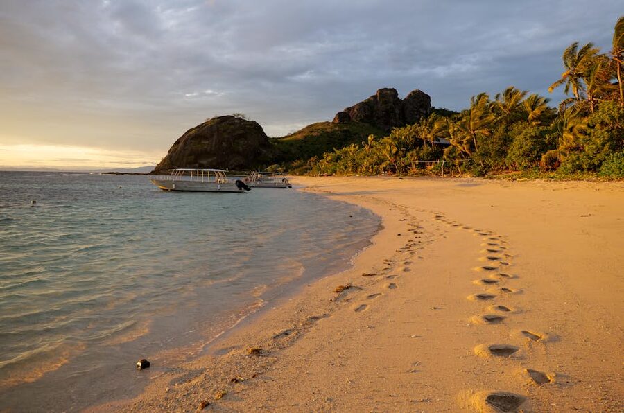 Footprints on a Yasawa beach at sunset, Fiji