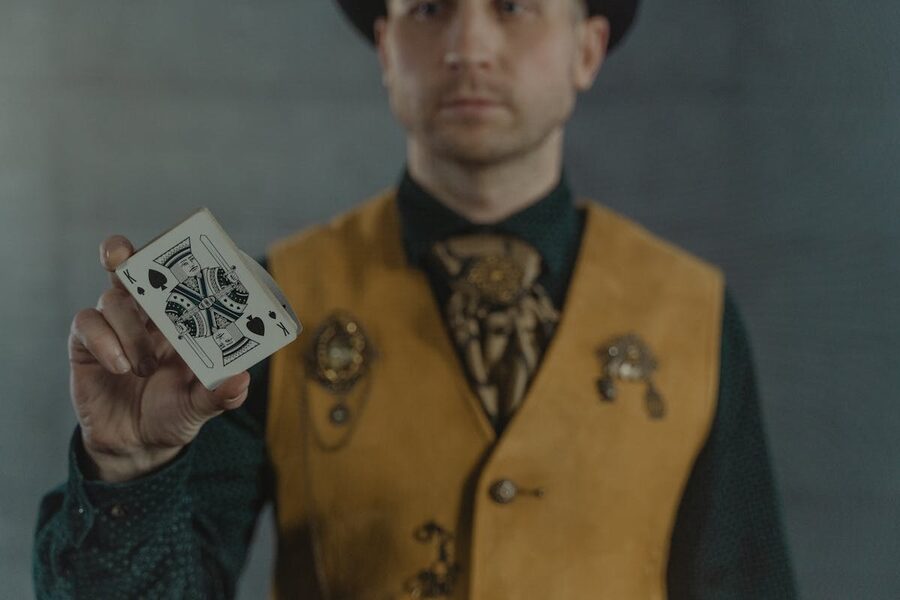 Magician displaying King of Spades card