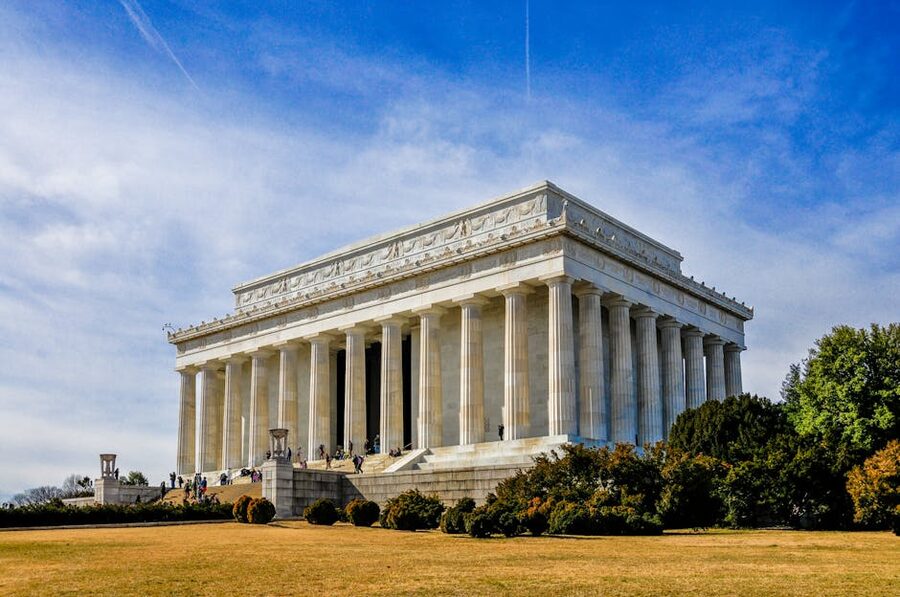 Tourists at the Lincoln Memorial on a clear day