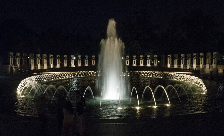 World War II Memorial pillars and fountain illuminated at night