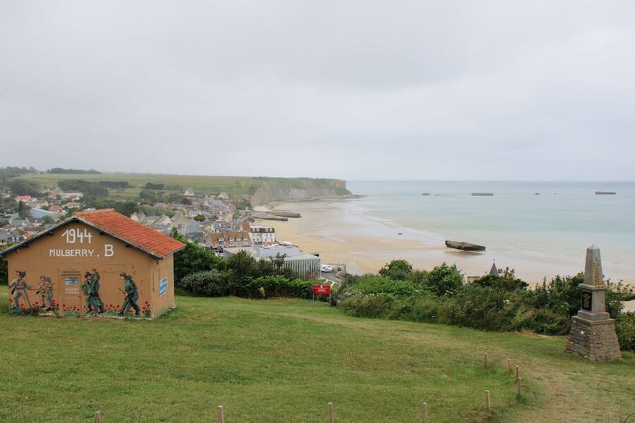 Mulberry harbour remains at Arromanches-les-Bains, Normandy, with concrete caissons offshore