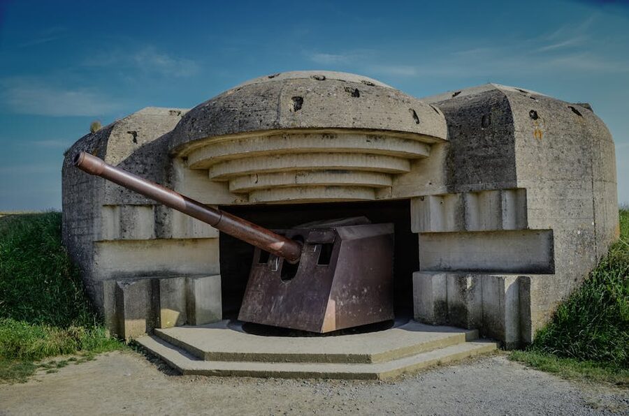 World War II bunker with artillery cannon on the Normandy coast, France
