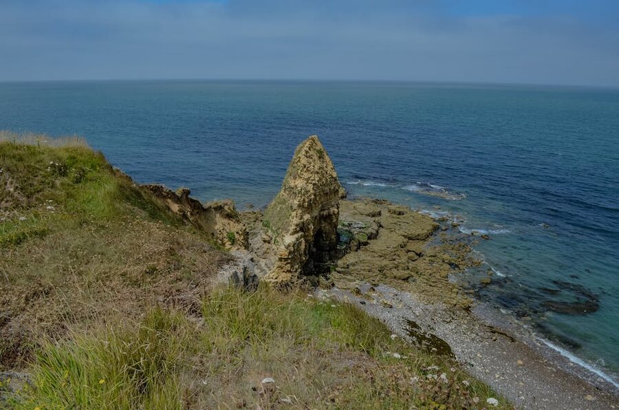 The rugged cliff coastline at Pointe du Hoc, Normandy, looking out to the English Channel