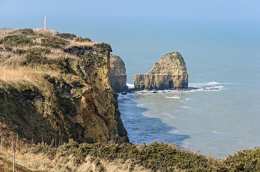 Pointe du Hoc cliffs with the Ranger Monument visible on the headland, Normandy