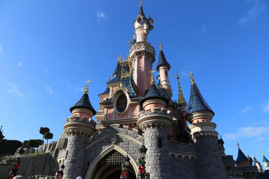 Disneyland Paris castle with tourists in the foreground