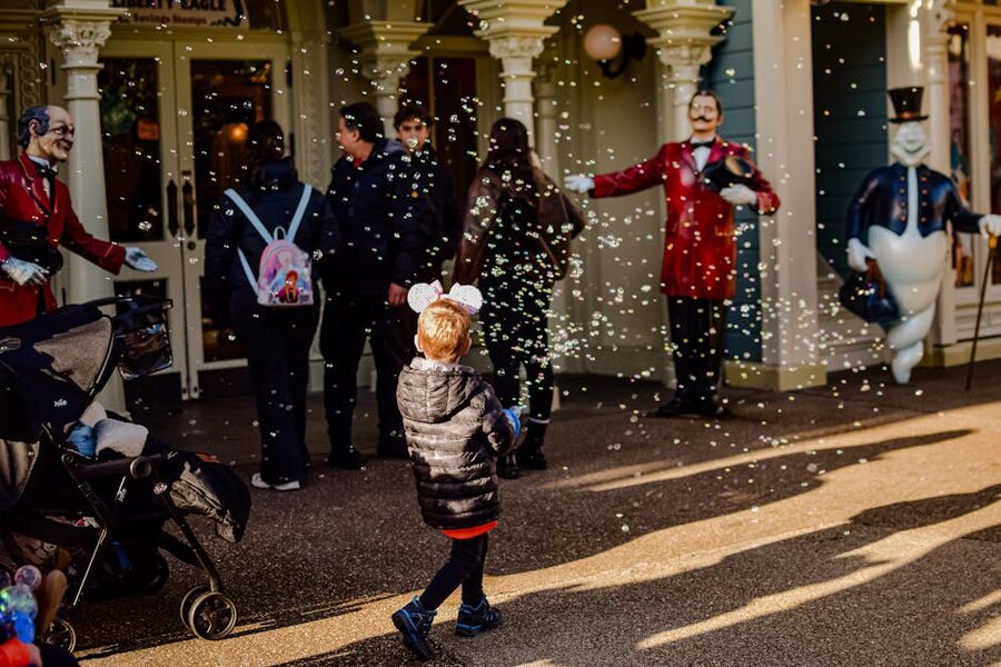 Child wearing mouse ears at Disneyland Paris entrance
