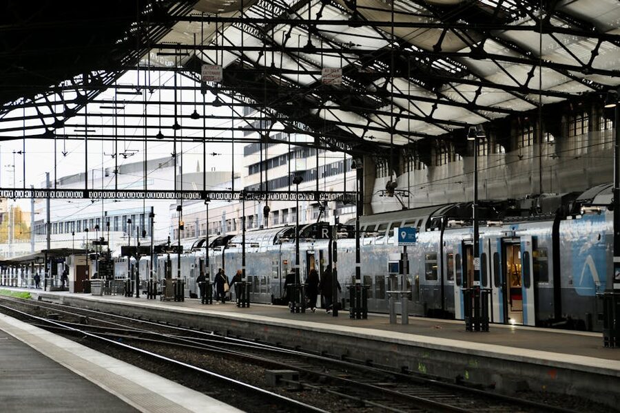 Paris train station with commuters at platform