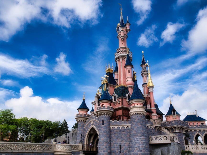 Sleeping Beauty Castle at Disneyland Paris under blue sky