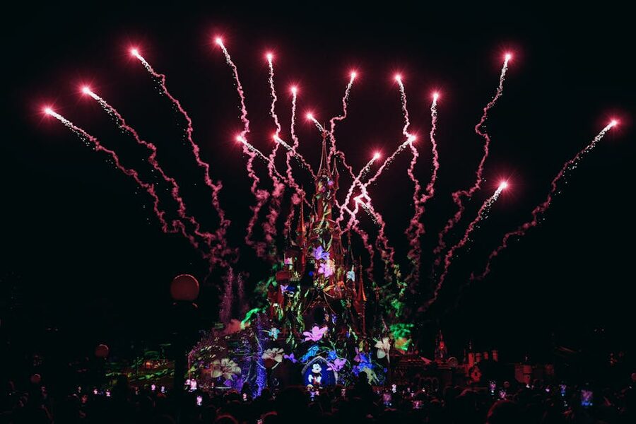 Fireworks over Sleeping Beauty Castle at Disneyland Paris from a hotel-side angle