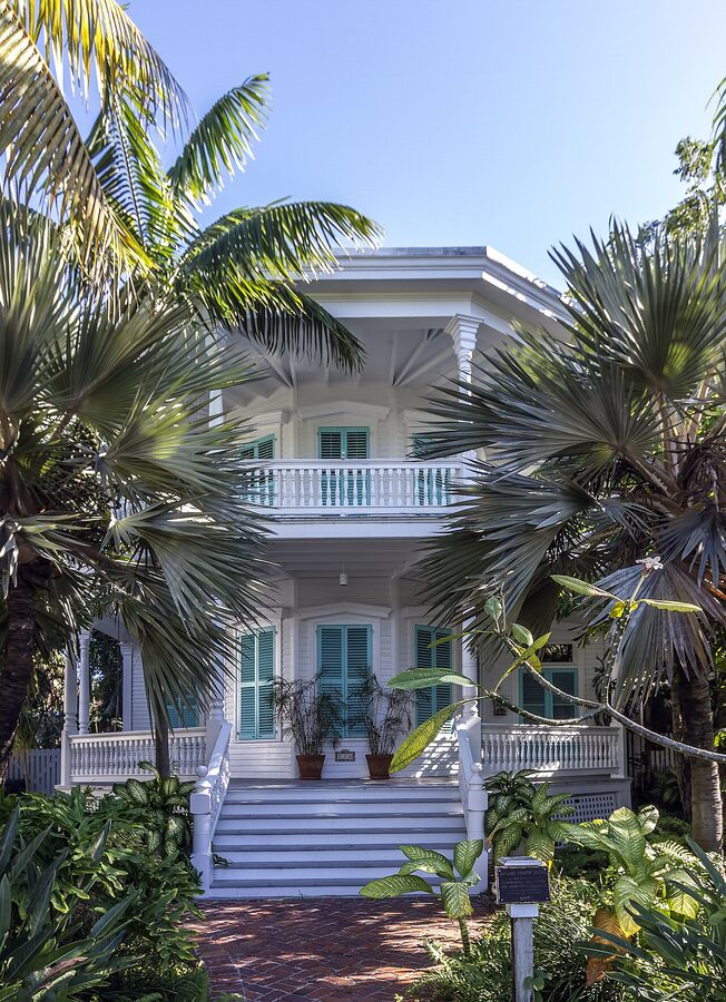 Two-story Conch house with wrap-around porch on Eaton Street in Key West