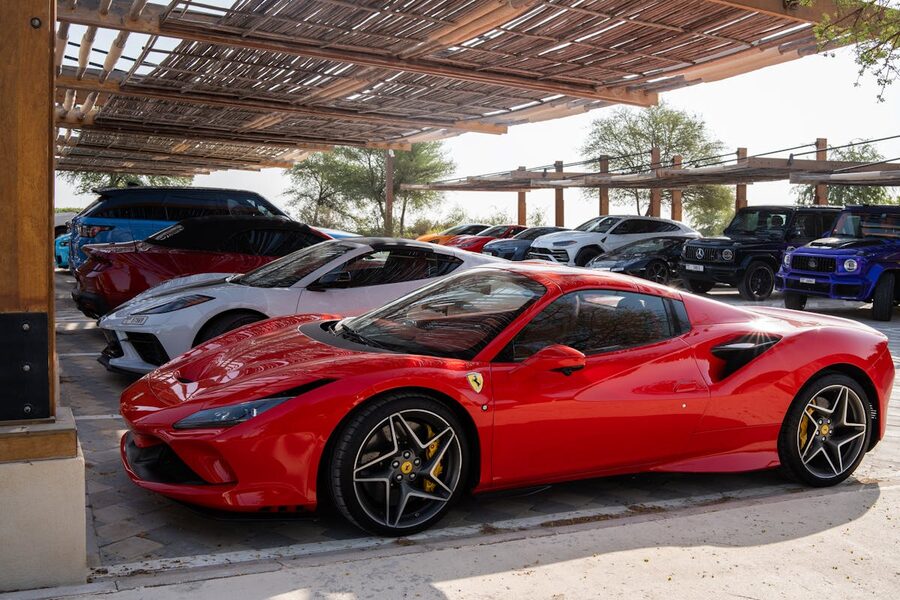 Collection of high-end sports cars parked at exotic car venue