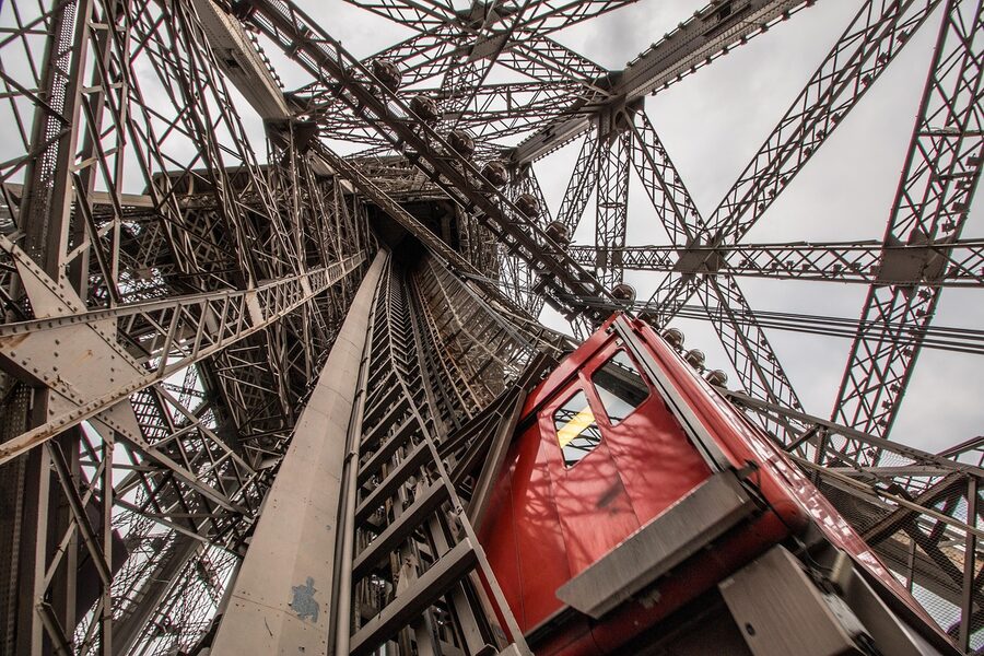 Looking up inside the Eiffel Tower elevator structure
