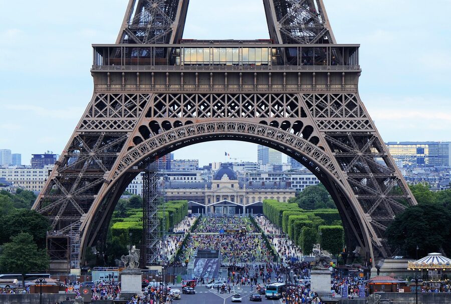 Eiffel Tower viewed through arch from beneath