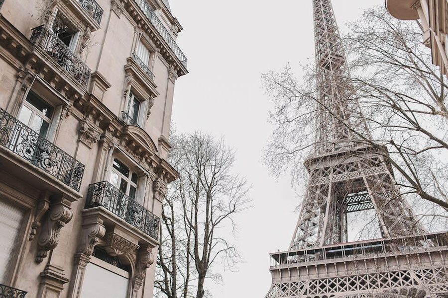 Eiffel Tower framed by classic Parisian Haussmann buildings