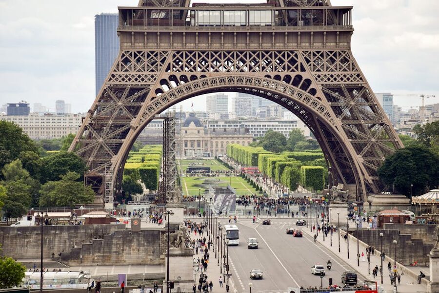 Paris street scene beneath the Eiffel Tower
