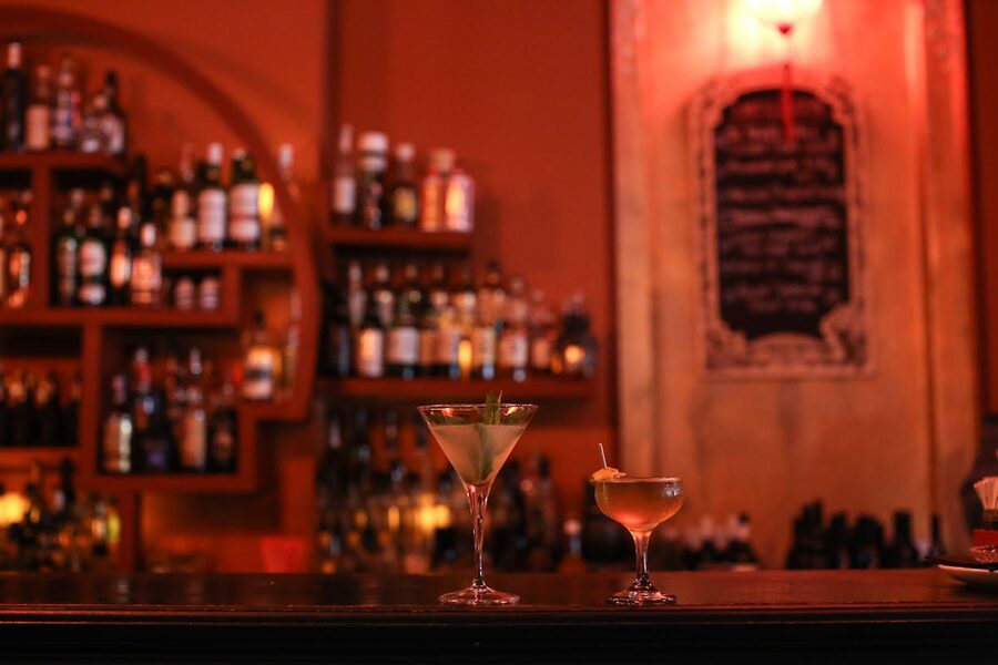 Elegant cocktails on a bar counter in a cozy nightlife setting
