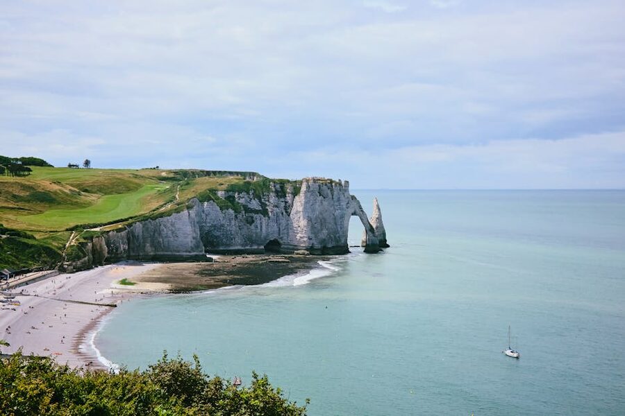 Falaise dAval natural arch and Aiguille at Etretat Normandy