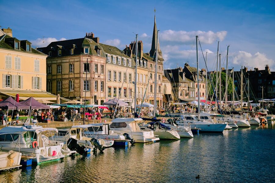 Honfleur marina at sunset with historic buildings