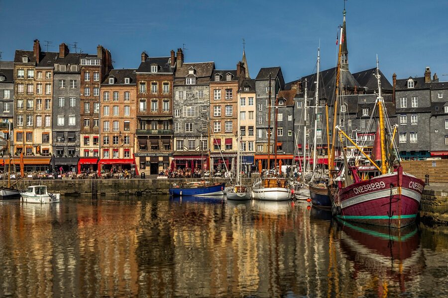 Honfleur port reflections boats and historic buildings
