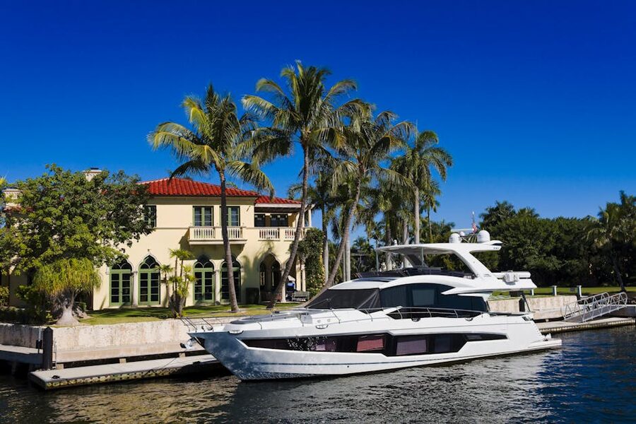Mega-yacht moored beside a waterfront mansion in Fort Lauderdale