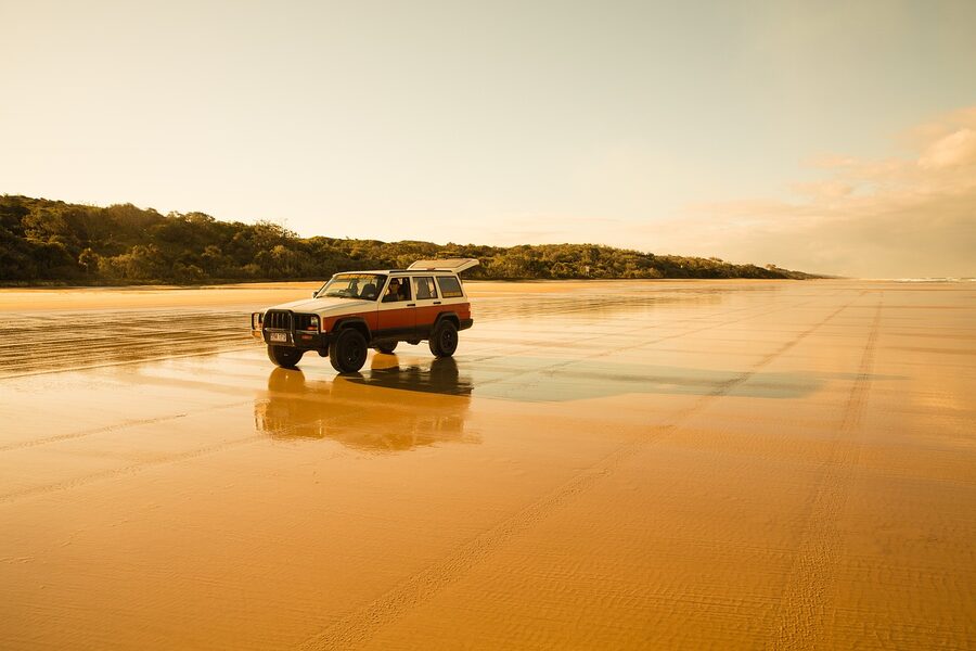 A 4WD on the beach highway on K'gari Fraser Island