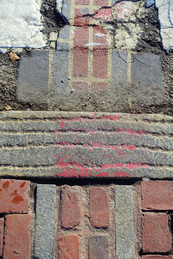 Grooved stone curb marking Freedom Trail on Beacon Hill Boston
