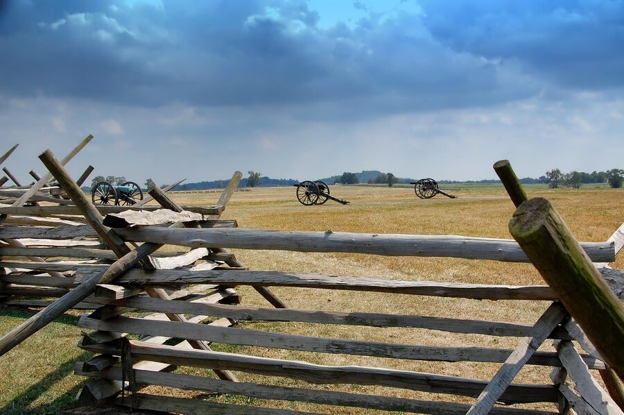 Gettysburg battlefield cannon behind split rail fence