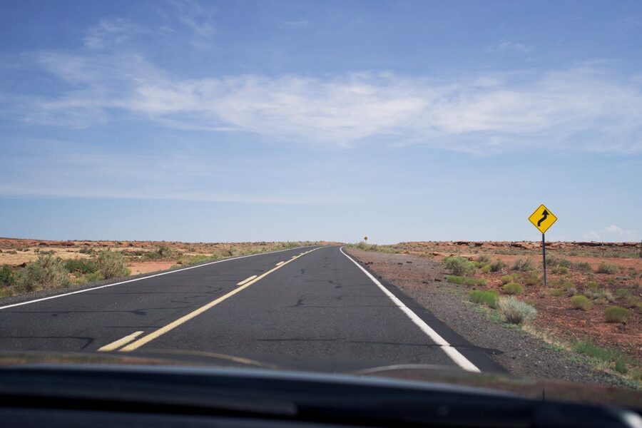 Endless desert highway stretching through vast landscape
