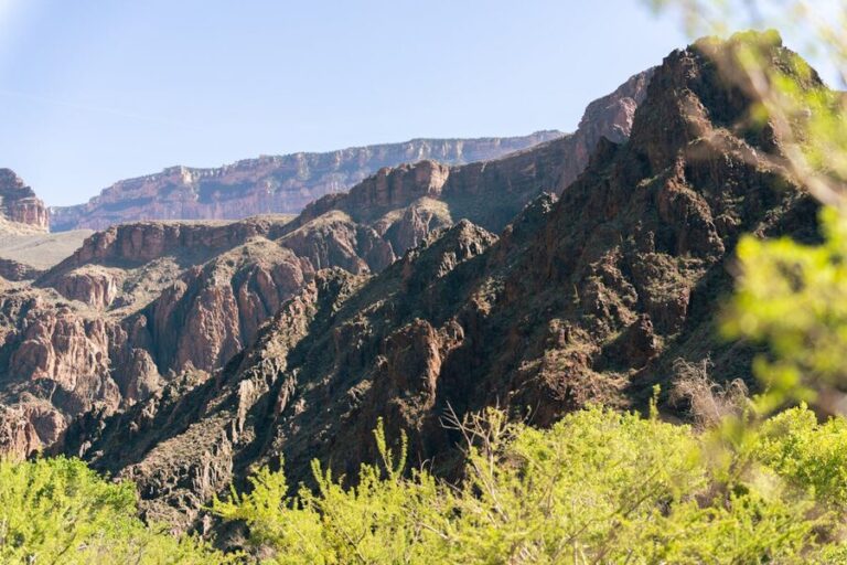 Grand Canyon South Rim cliffs against clear blue sky