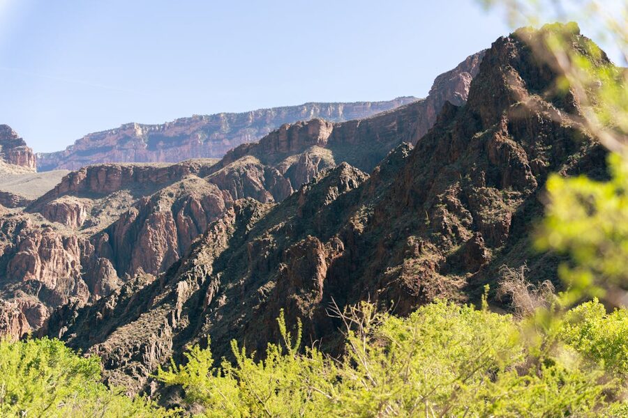 Grand Canyon South Rim cliffs against clear blue sky