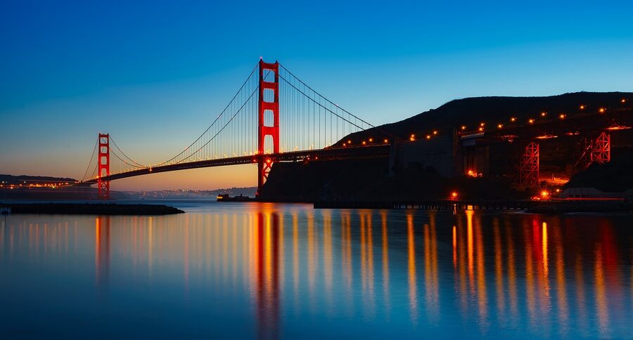 Golden Gate Bridge illuminated at dusk panorama