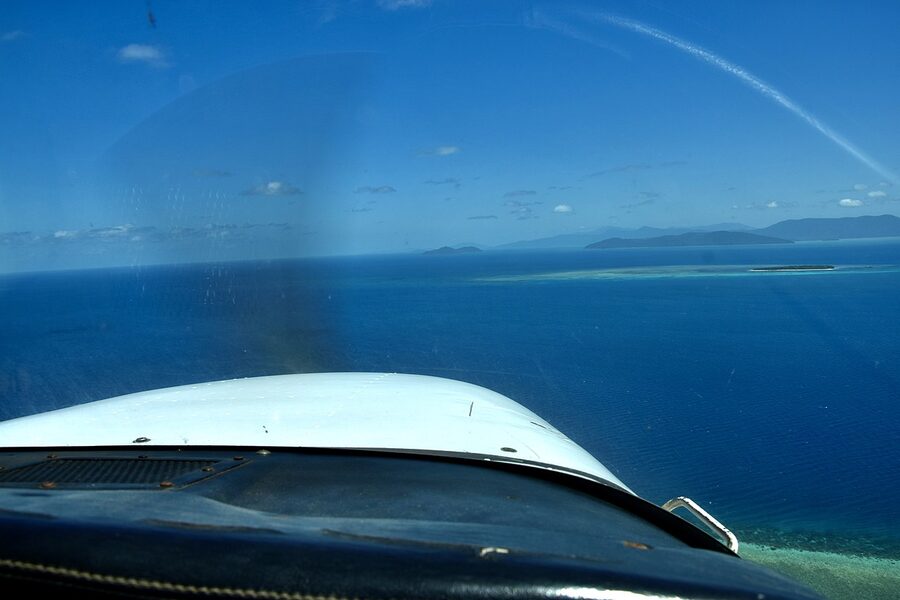 Aerial view of the outer Great Barrier Reef edge meeting deep blue water