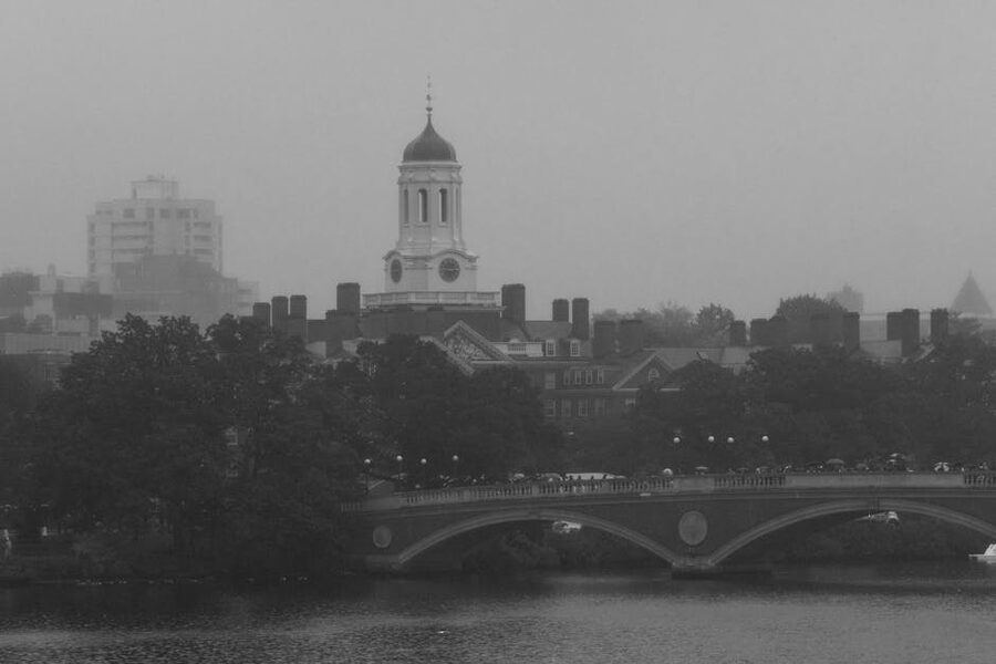 Harvard clock tower and Weeks Footbridge over Charles River in fog