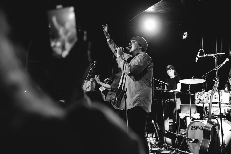 Concert stage with band, singer, drums and guitar