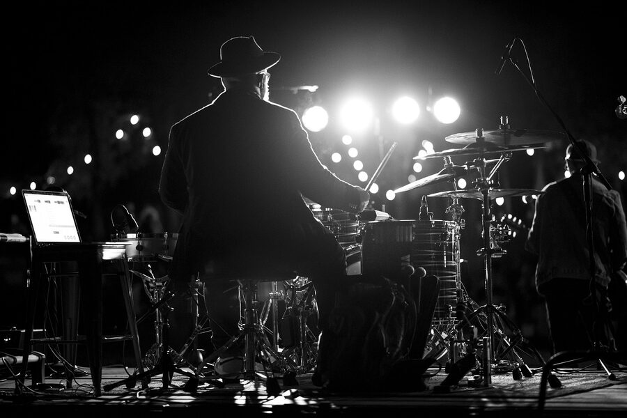 Drummer performing on stage during a concert