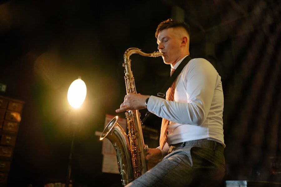 Saxophonist under a spotlight on stage